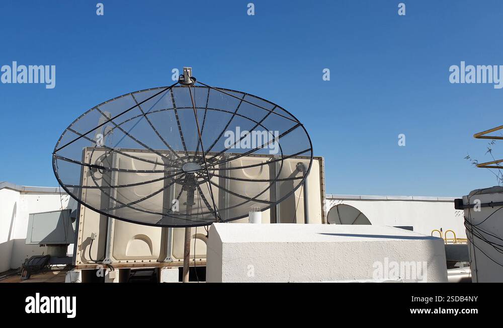 Building with attached satellite dishes for receiving TV or radio ...