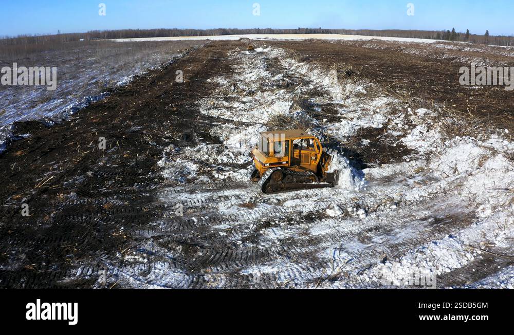Bull Dozer clearing bush to make farmland for new crops to be platned ...