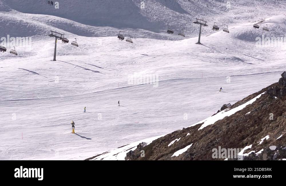 Big total picture in the Alpine, skiing people, and Skilifts can be ...