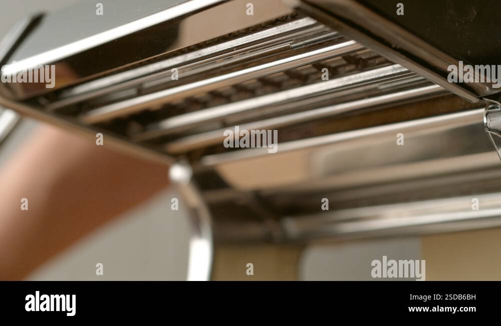 Camera follows fresh pasta coming out of pasta machine. Slow Motion ...