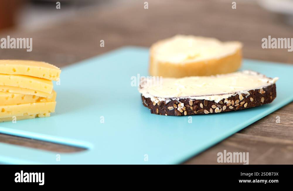 Laying Over The Slices Of Cheddar Cheese On Top Of Sliced Bread ...