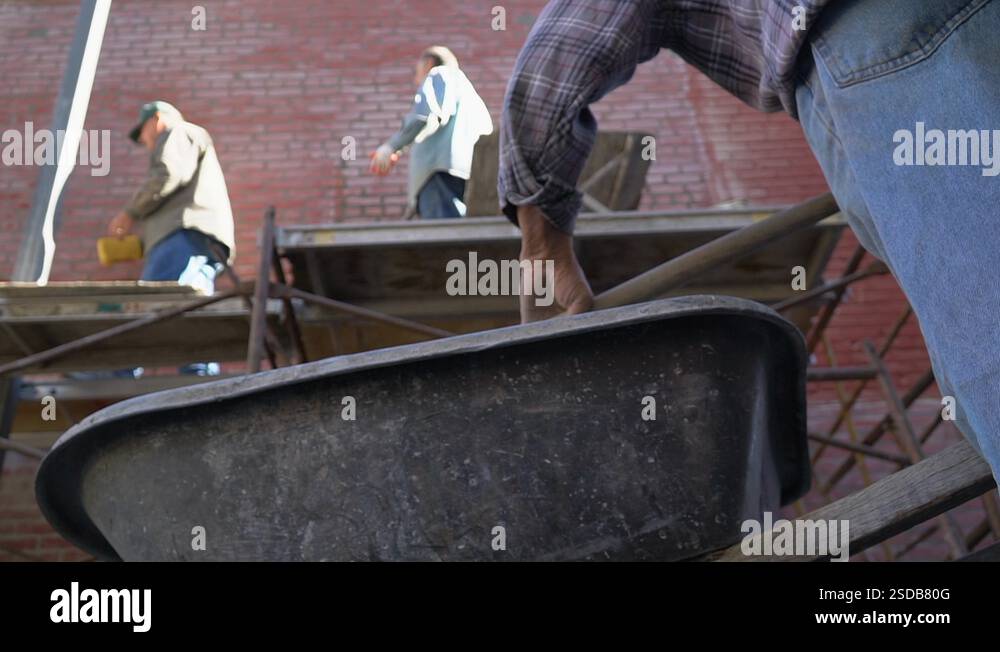 A Man Mixing Cement Manually In A Mortar Basin With A Shovel In Boise ...