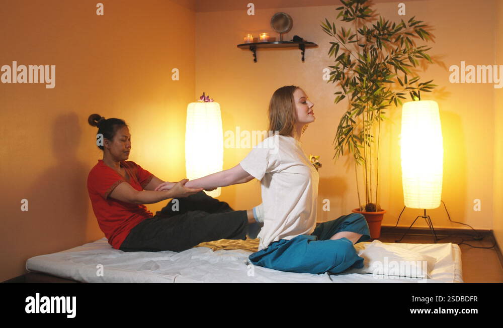 Thai Massage stretching therapy Stock Video Footage - Alamy