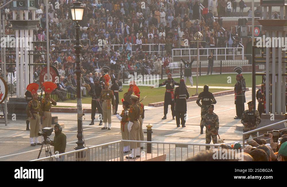 Pakistani and Indian Border Security Guards in Uniforms Kicking at ...