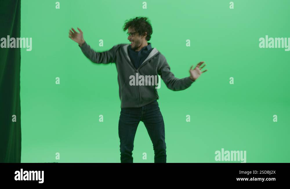 Green Screen Chroma Key Studio: Smiling Young Man in Casual Clothes ...