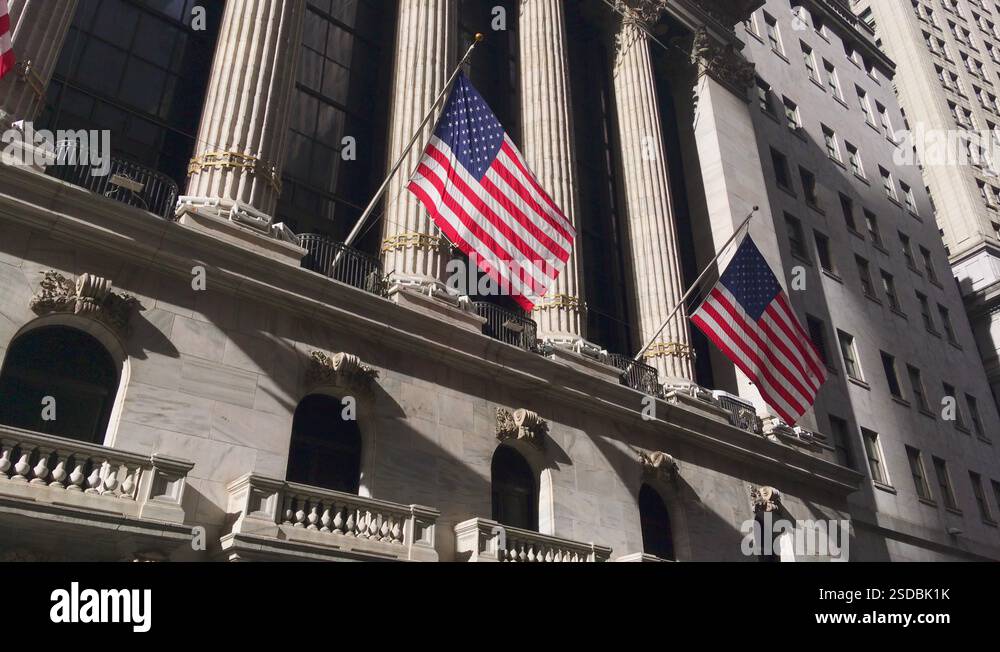 Wall street stock exchange flags, pan right Stock Video Footage - Alamy