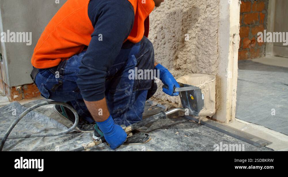 Renovation works, use of the plaster hopper bucket on the wall, 4k ...