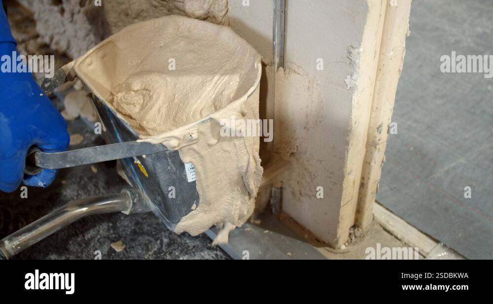 Spraying of the plaster on the wall during the renovation, tools, 4k ...
