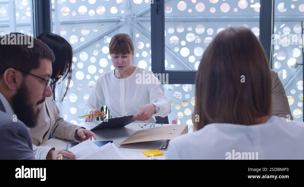 Brainstorming concept of male and female mixed-races team. Meeting of ...