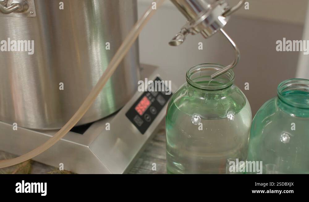 Alcohol dripping into a jar. Last step of a Distillery Where Final ...
