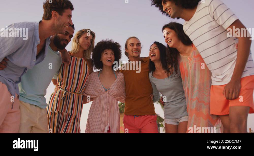 Friends side by side on the beach Stock Video Footage - Alamy