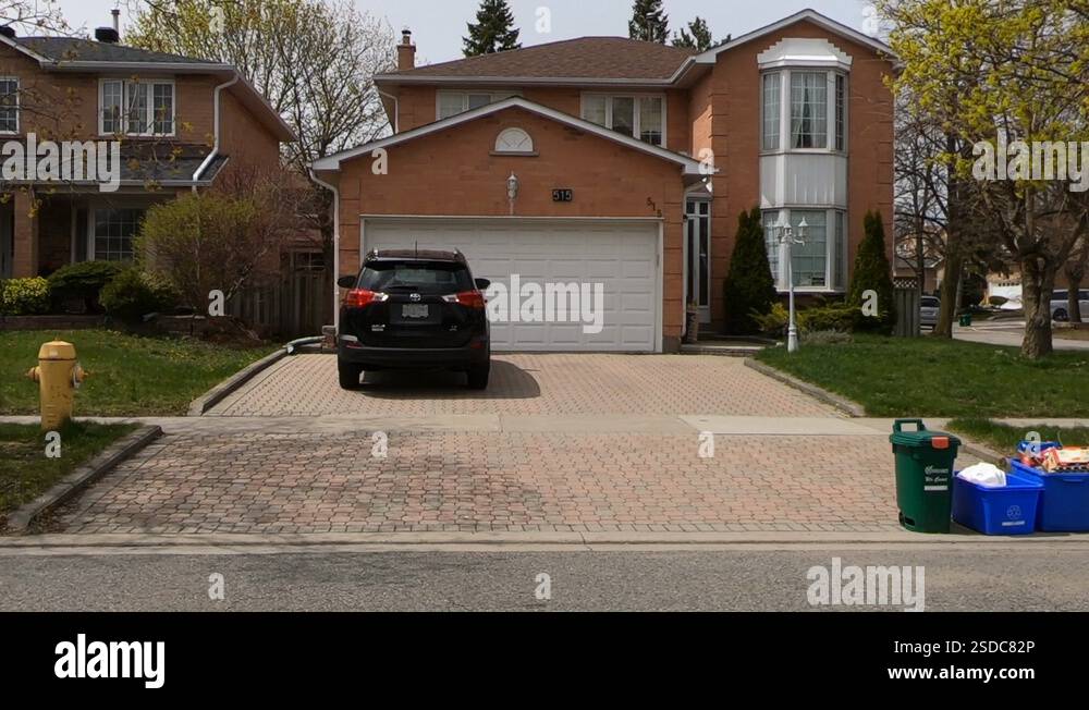 POV side view suburban residential neighbourhood in Markham Canada ...