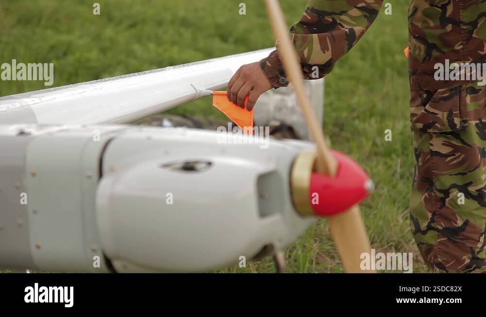 Close up shot of man takes off covers from propeller of commercial ...