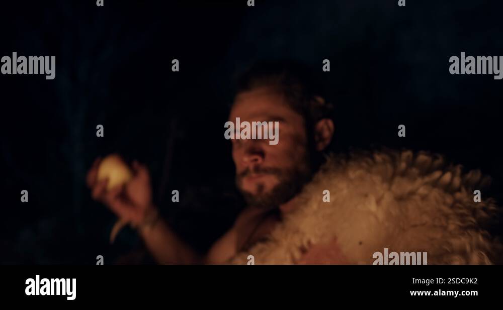 Scared man eating apple at night Stock Video Footage - Alamy
