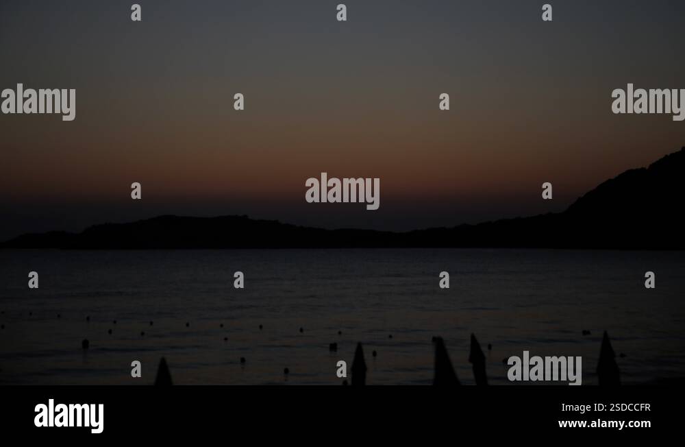 Time lapse. Sunrise from behind the mountains in Greece on the island ...