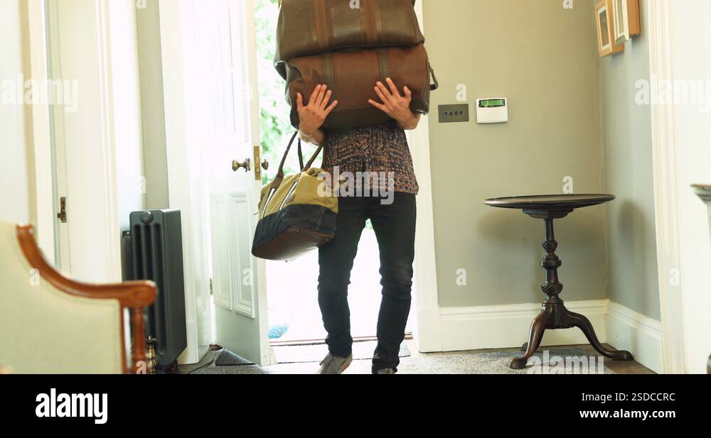 Man dropping bags on floor Stock Video Footage - Alamy