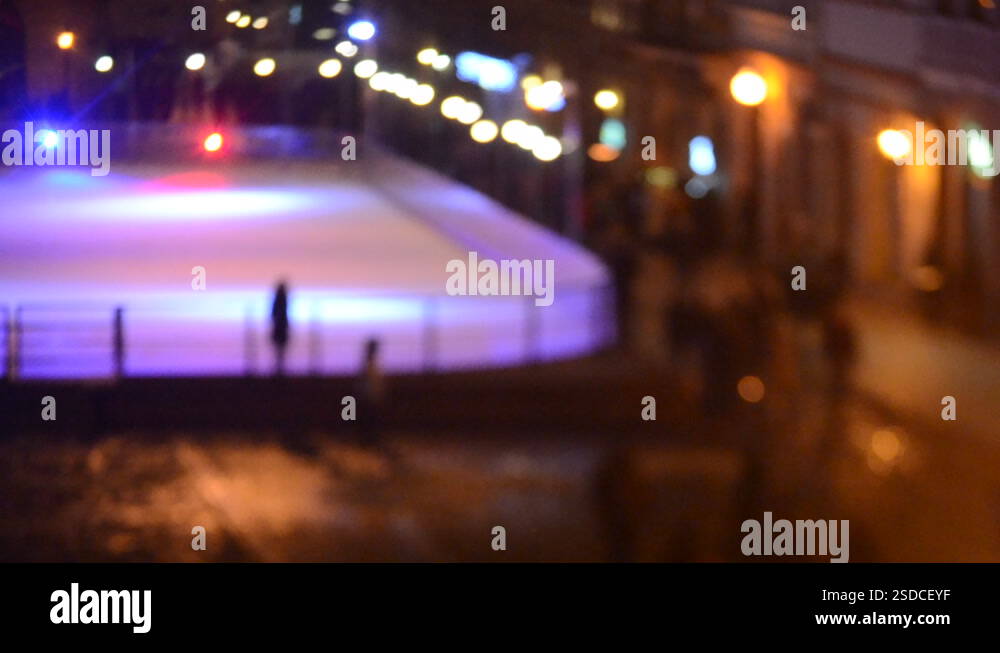 Blurred Background. Outdoor skating rink, open-air ice rink on square ...