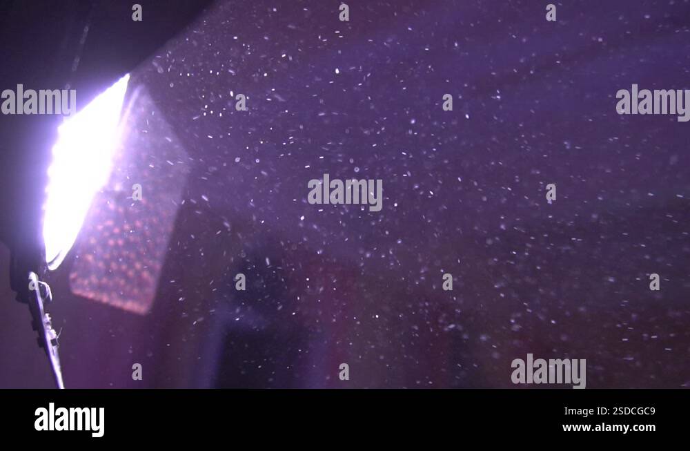 Bright spotlight in a nightclub in which dust particles fly, background ...