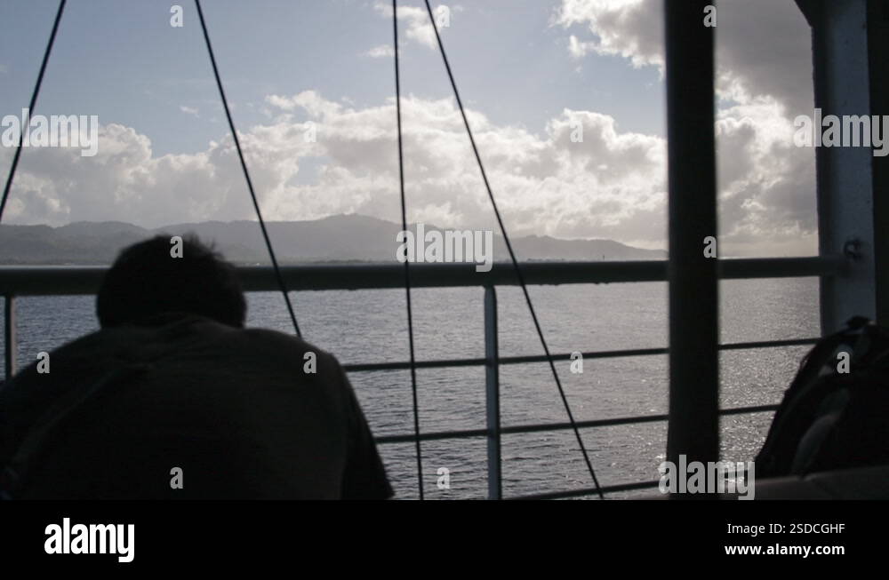 Back View Of A Man Sitting On The Ferry Boat Cruising On The Calm Ocean ...