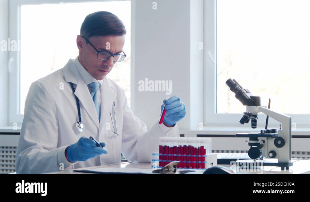 Scientist working in lab. Doctor making microbiology research ...