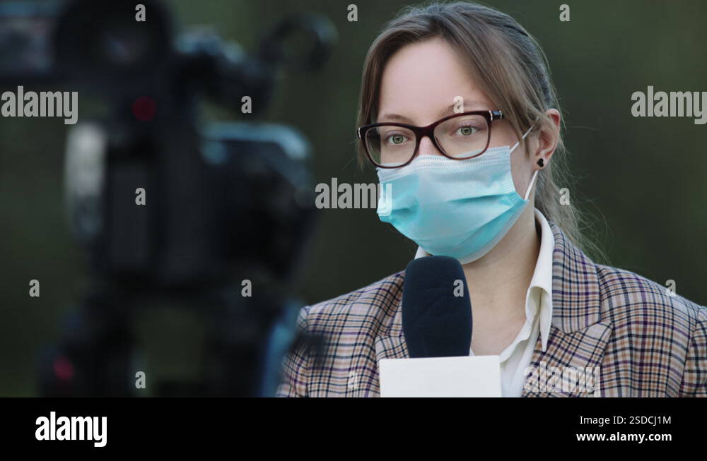 Breaking news, during coronavirus pandemic. Female reporter with ...