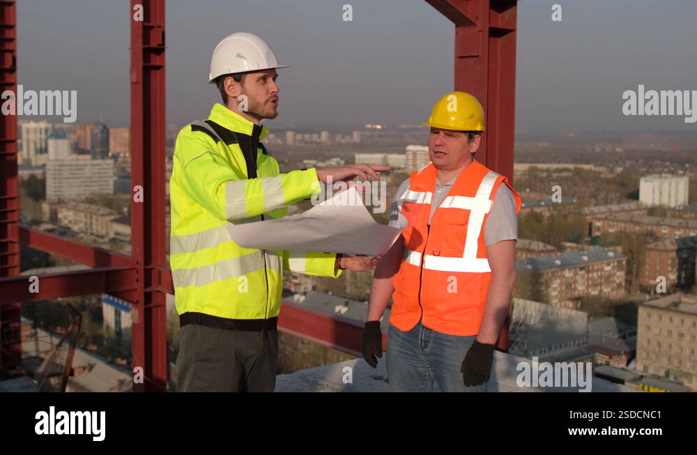 Two male builders engineers men, contractor investor worker foreman ...