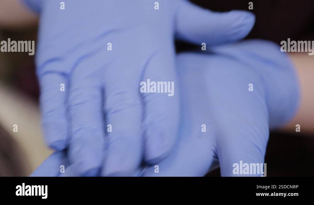 Professional beautician puts gel on gloves and rubs it Stock Video ...