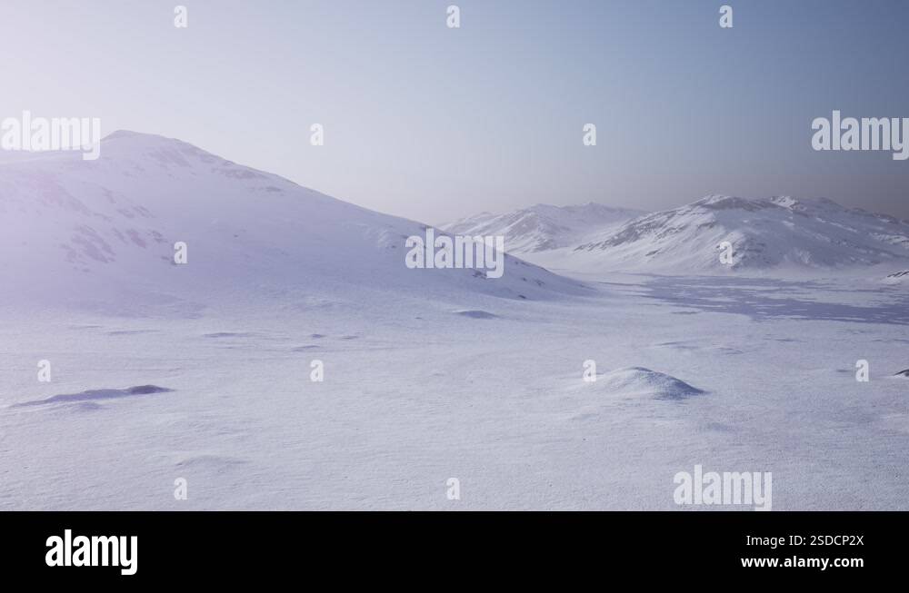 Aerial Landscape of snowy mountains and icy shores in Antarctica Stock ...