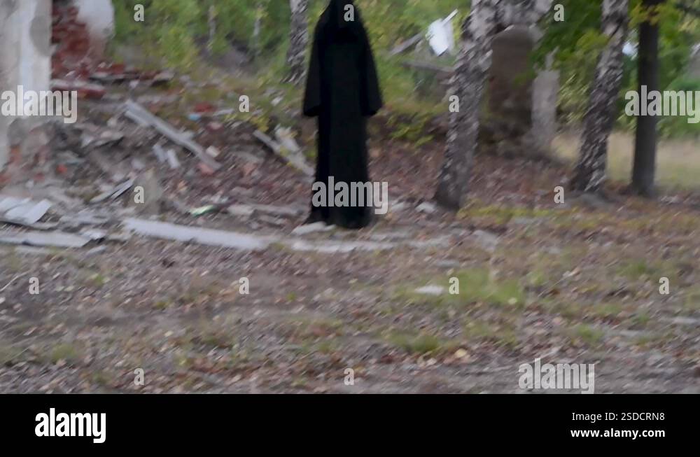 Death in the hood. The camera shudders as it approaches a man in a ...