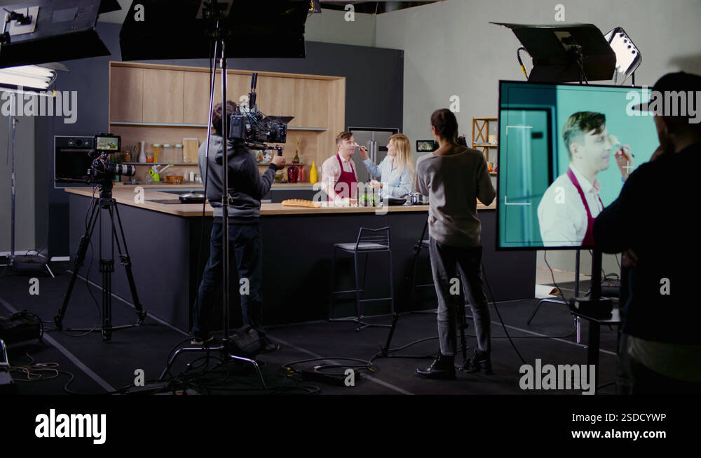 Behind the scenes makeup artist make corrections during shooting TV ...