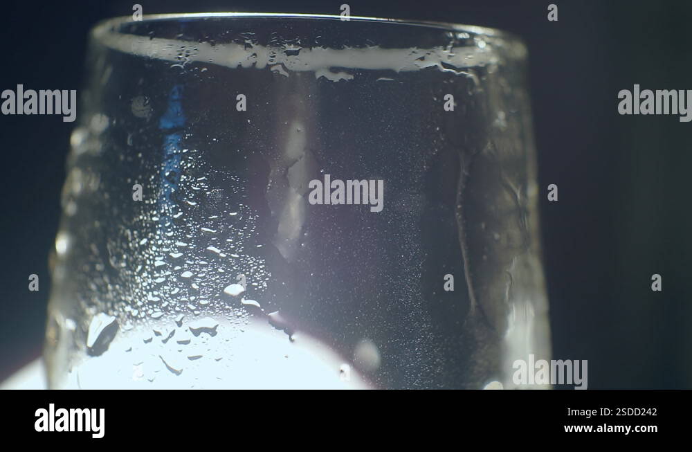 jet of a refreshing drink flows beautifully into a glass beaker Stock ...