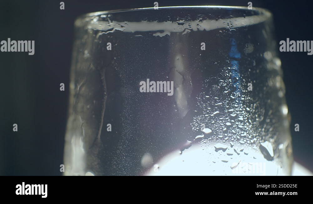 jet of a refreshing drink flows beautifully into a glass beaker Stock ...