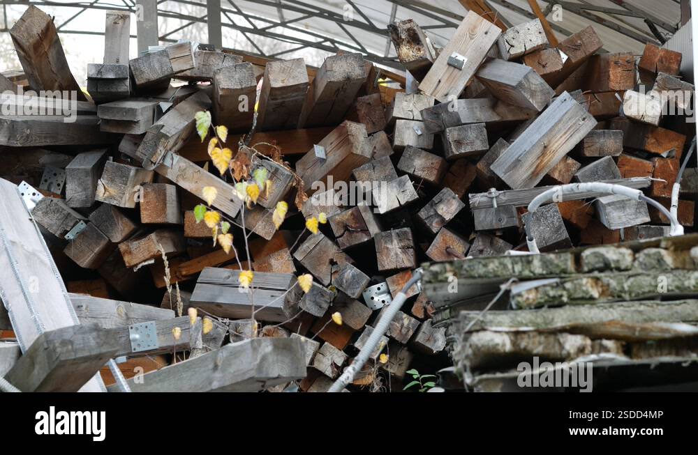 Wooden bars and other building materials are piled up after building ...