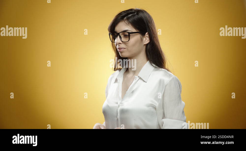 Happy south asian woman in glasses getting surprised and cheering ...