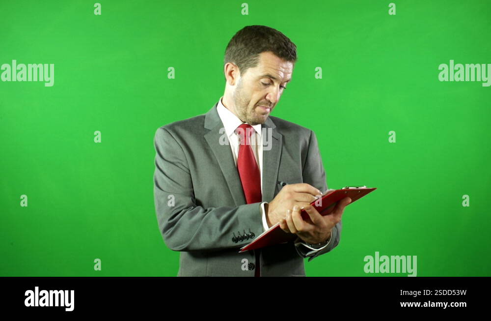Businessman in Suit using a Clipboard. Business. Green screen Chroma ...