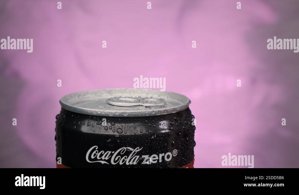 hand opens can of Coca Cola close-up on crimson background Stock Video ...
