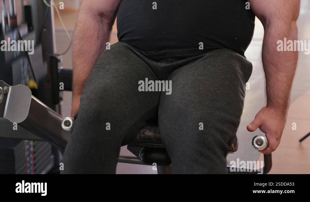 Very large bearded bodybuilder trains legs in the gym Stock Video ...