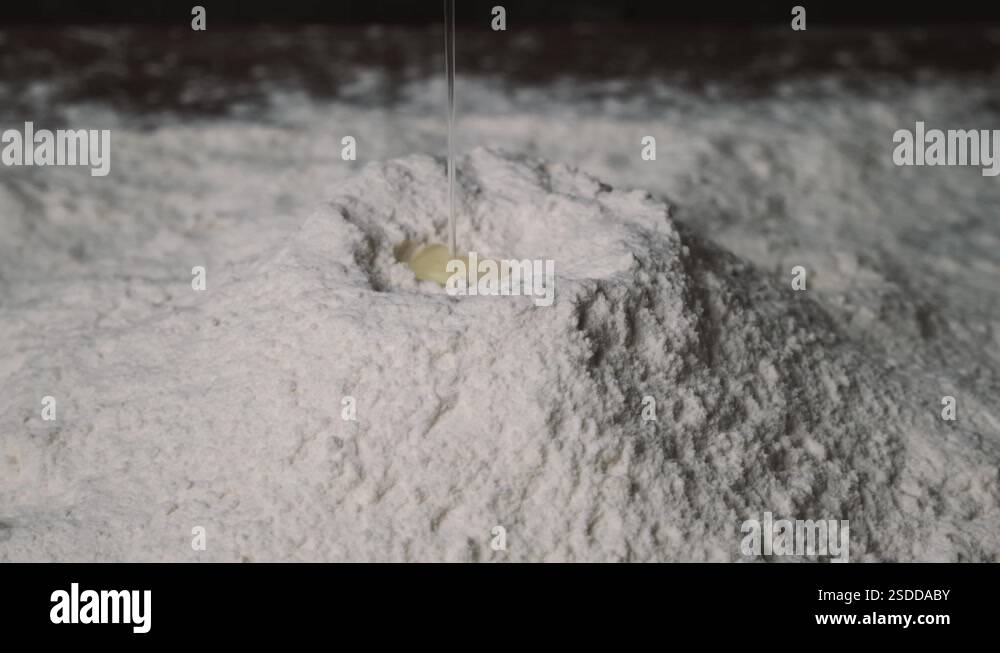 Falling eggs into flour stock. Footage food. Egg dropping into flour ...
