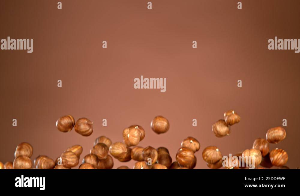 Super Slow Motion Shot of Flying Hazelnuts After Being Exploded on ...