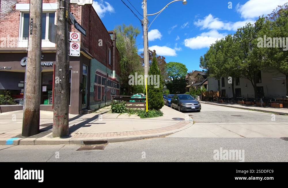 POV side view of Toronto city street with retail stores during COVID 19 ...