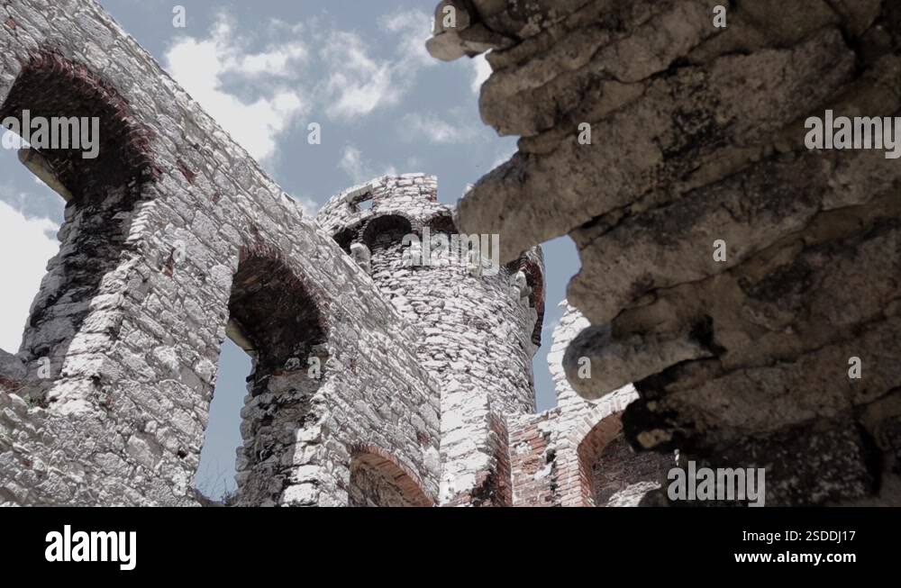 A revealing shot of the ancient and medieval stone tower in the ruins ...