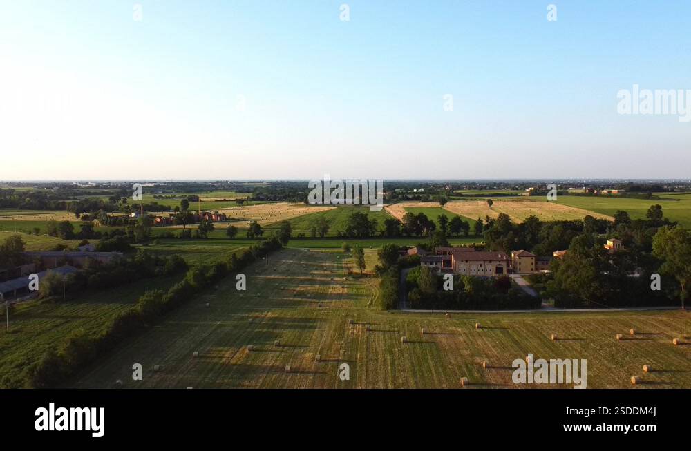 Flying Over The Beautiful Vast Field With Hay Bales On The Countryside ...