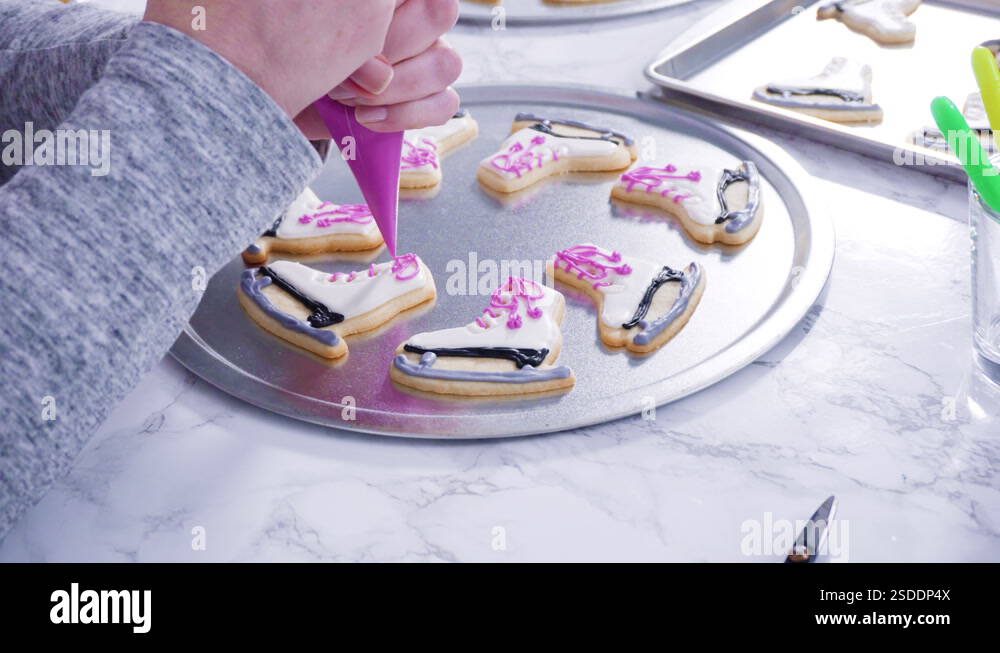 Icing figure skate shaped sugar cookies with royal icing Stock Video ...