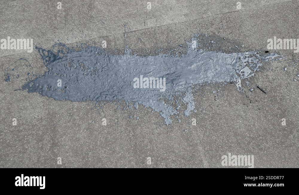 repair roof. patch filled in with tar, bitumen for roofing felt on roof ...