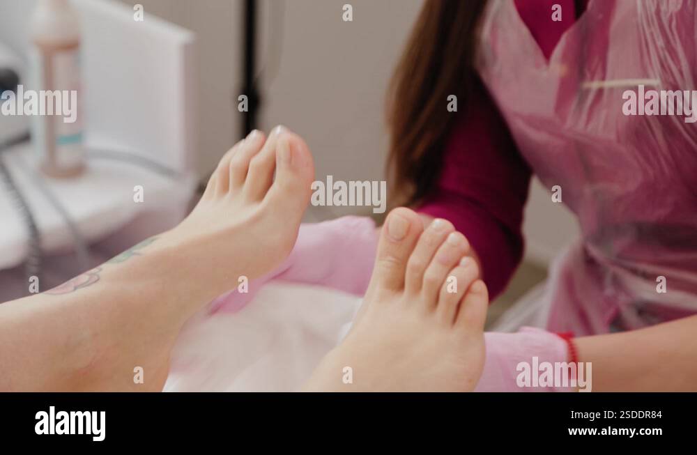 Pedicure master cleans the legs of a woman Stock Video Footage - Alamy