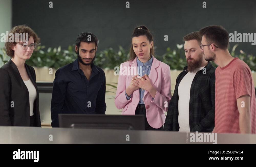 Video conference of office workers conducting teamwork folding hands in ...