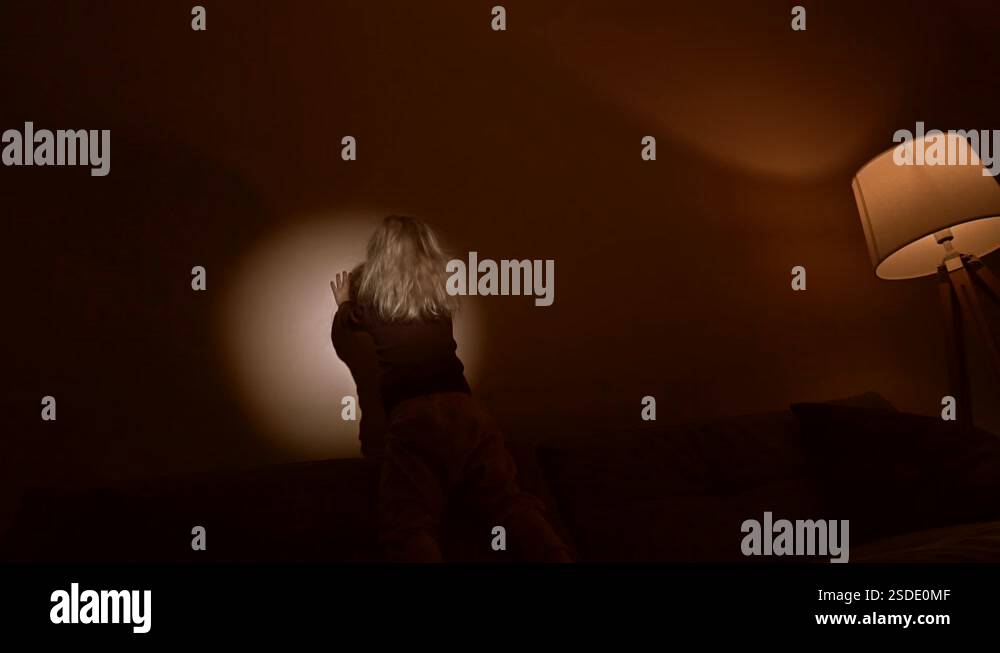 A little girl playing with a beam of light in the bedroom Stock Video ...