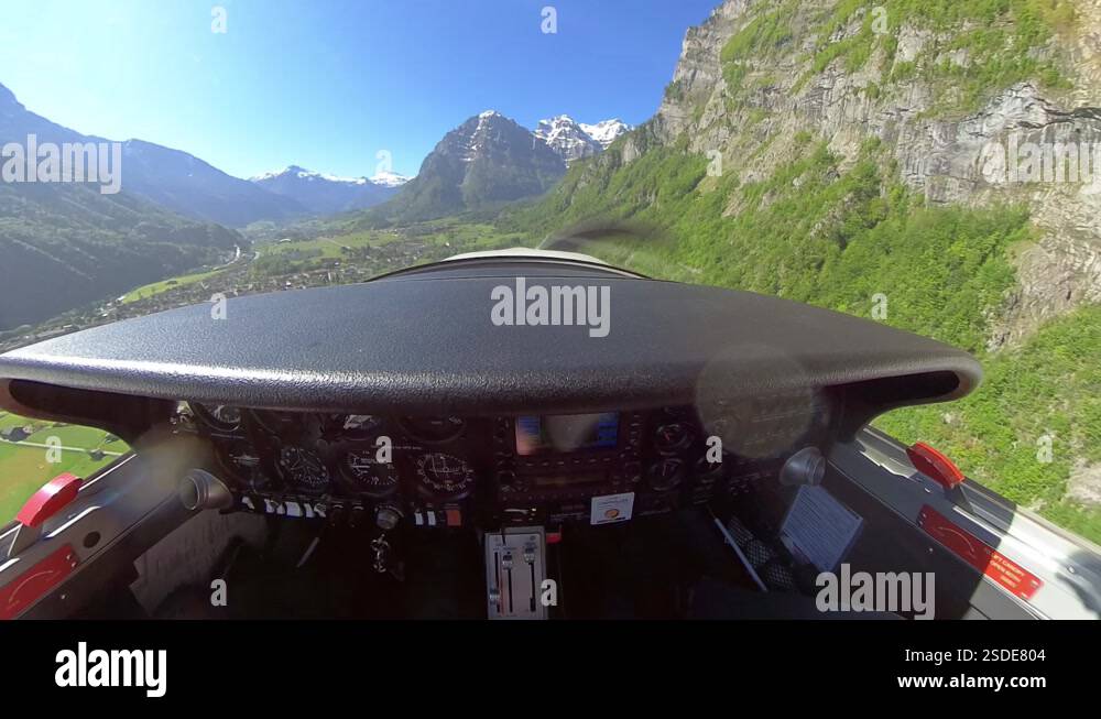 View from inside the cockpit of a small private jet, flying over ...