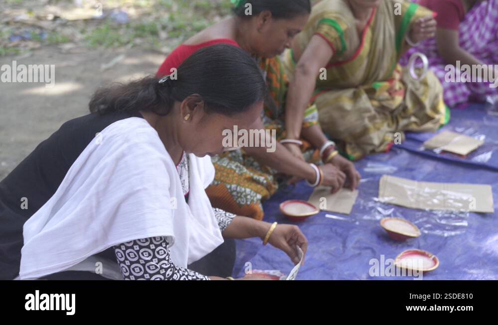 Asian tribal women working together handcraft items at outdoor ...