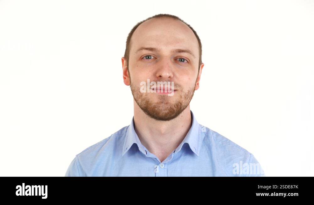 Handsome european man smiling at camera and showing call me gesture ...